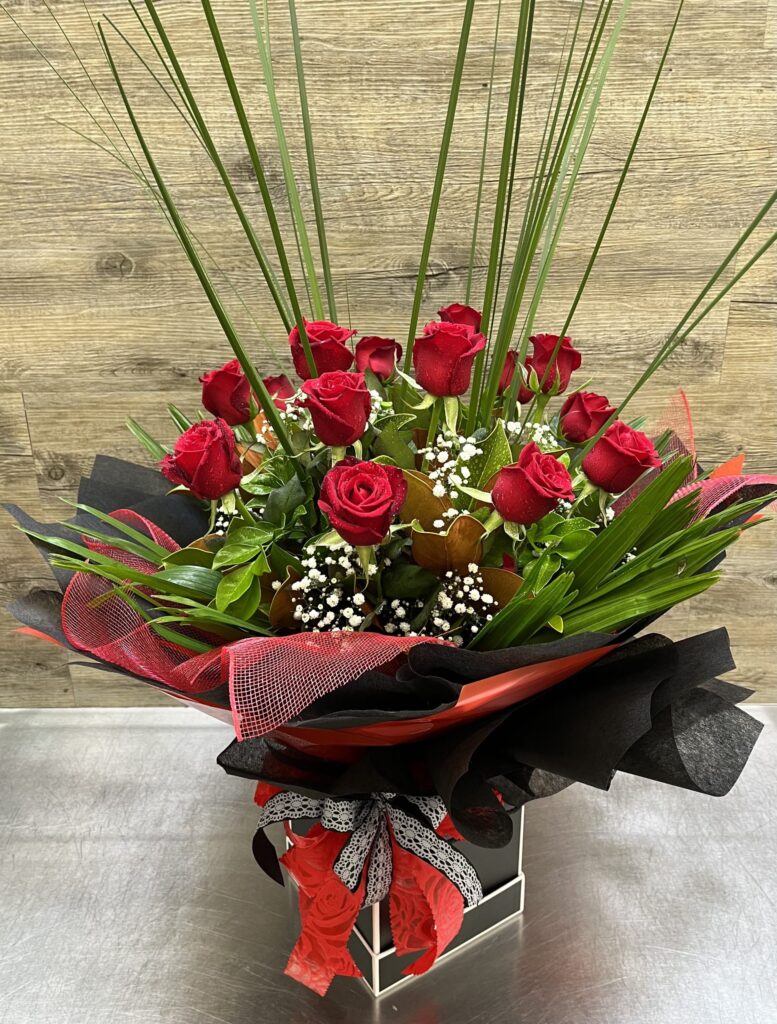 1 Doz Long Stemmed Red Roses with lush greenery - Lavish Flowers Online